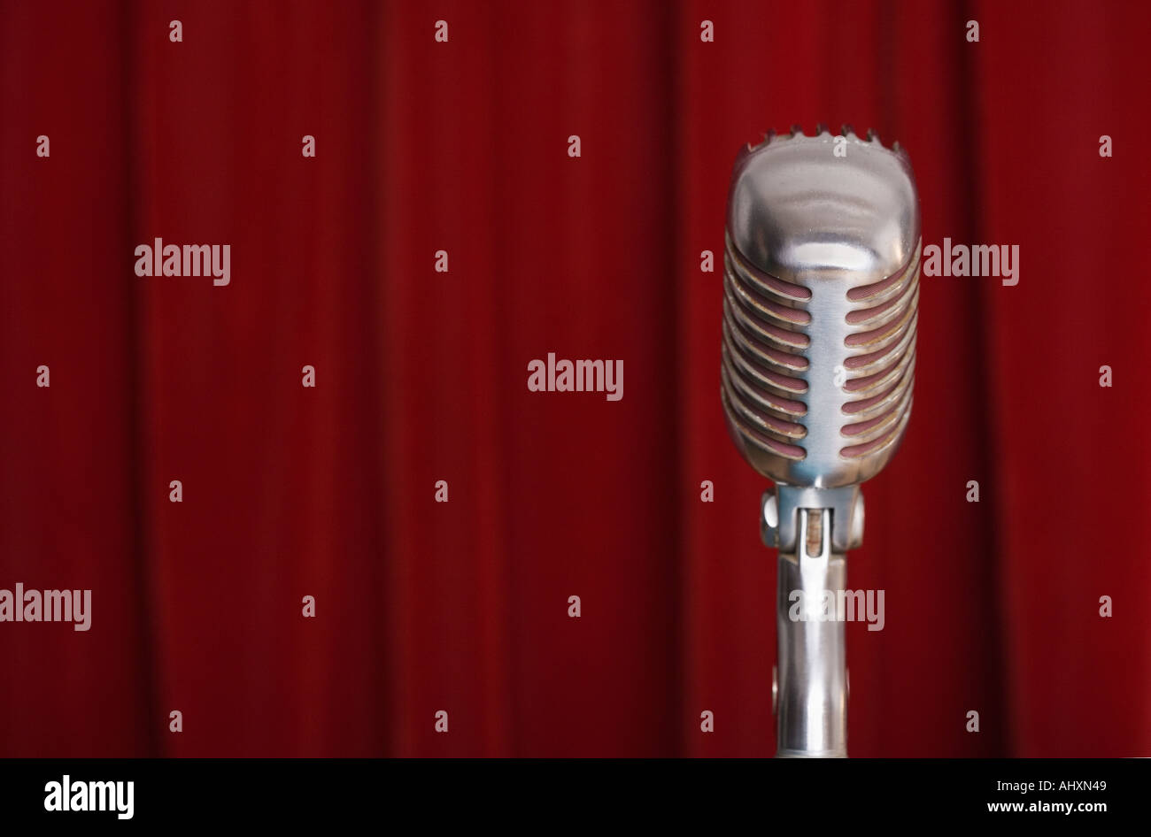 Old fashioned microphone with red curtain Stock Photo - Alamy