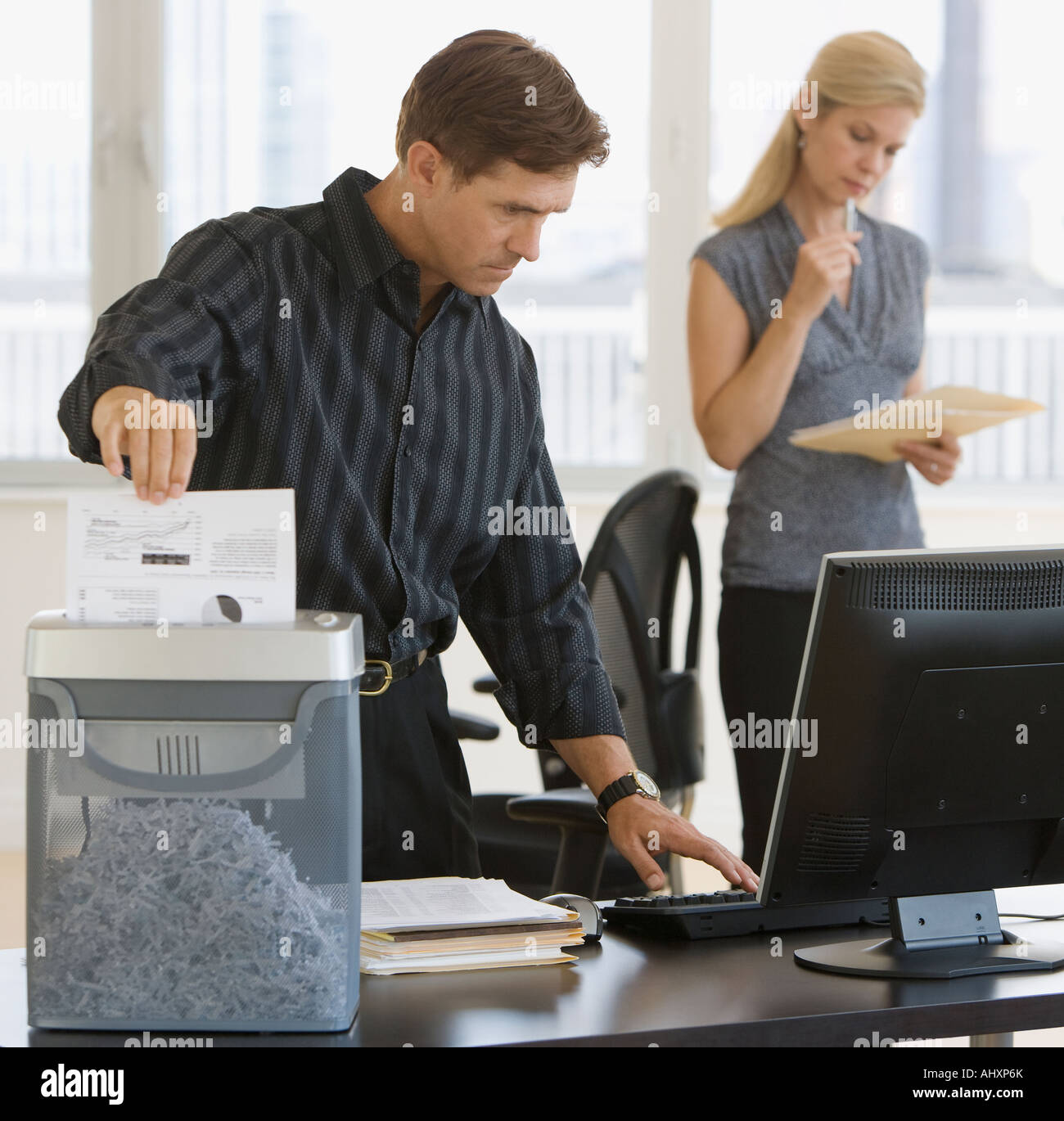 Businessman shredding paperwork Stock Photo - Alamy Businessman shredding paperwork Stock Photo - Alamy