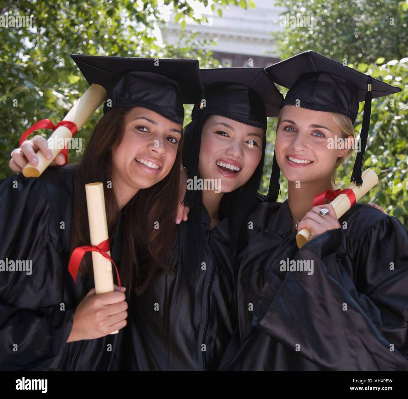 Group of college graduates having photograph taken Stock Photo - Alamy