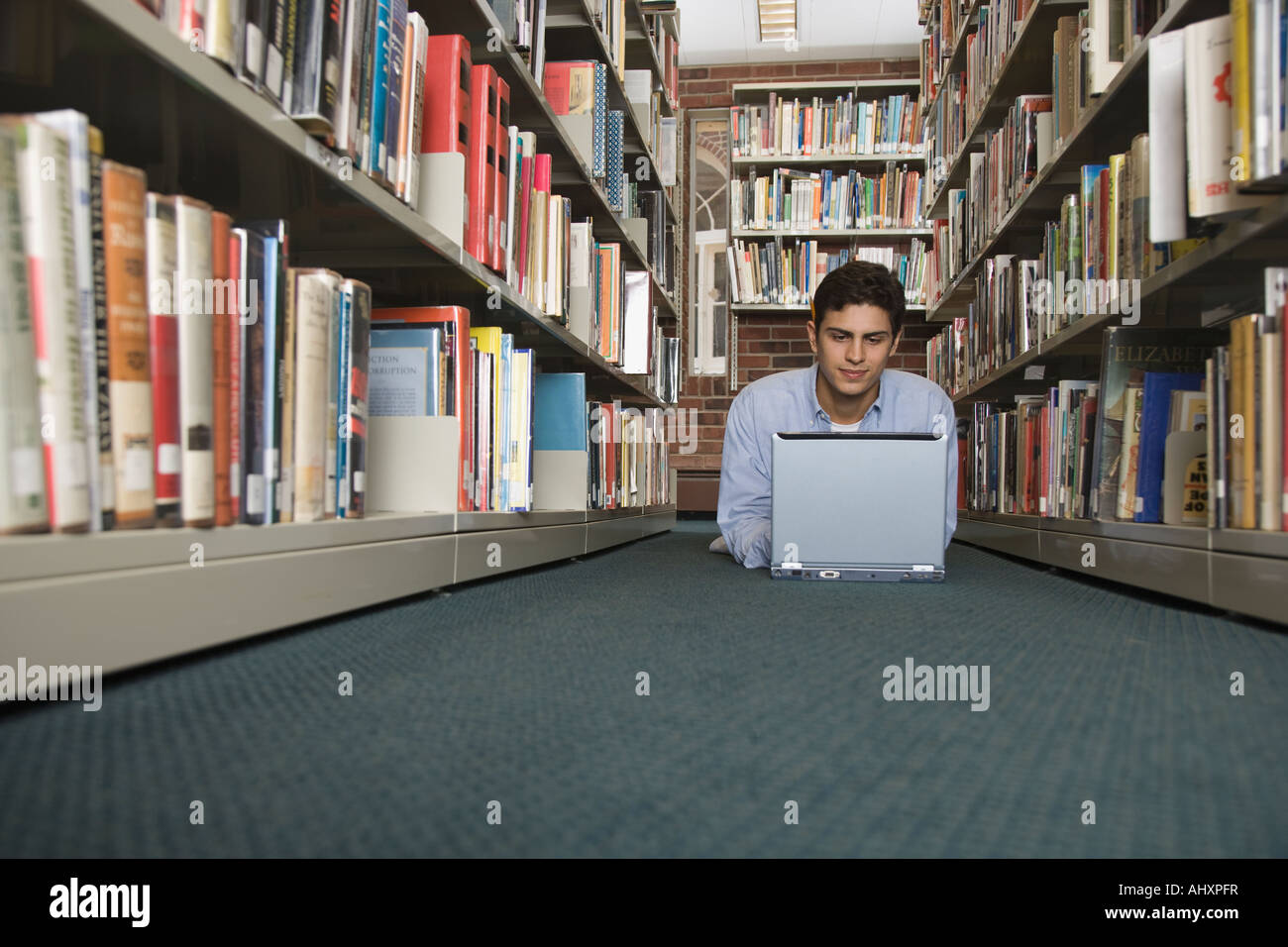 Asian woman carrying stack of books Stock Photo - Alamy