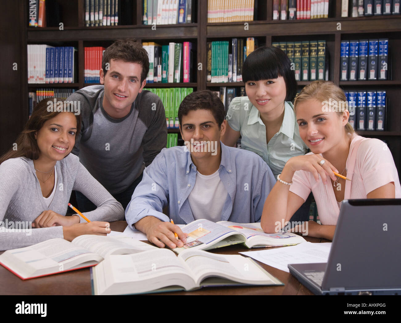 Female college student studying in library Stock Photo - Alamy