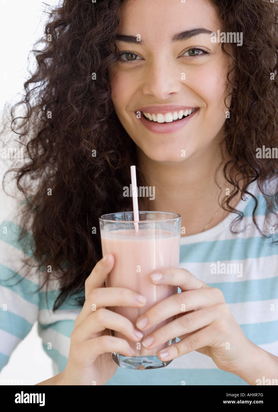 Woman drinking milkshake Stock Photo - Alamy