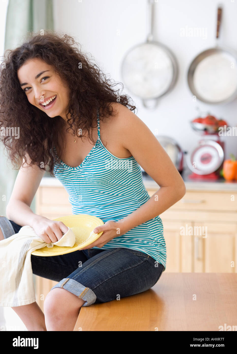 Woman drying off dish Stock Photo - Alamy