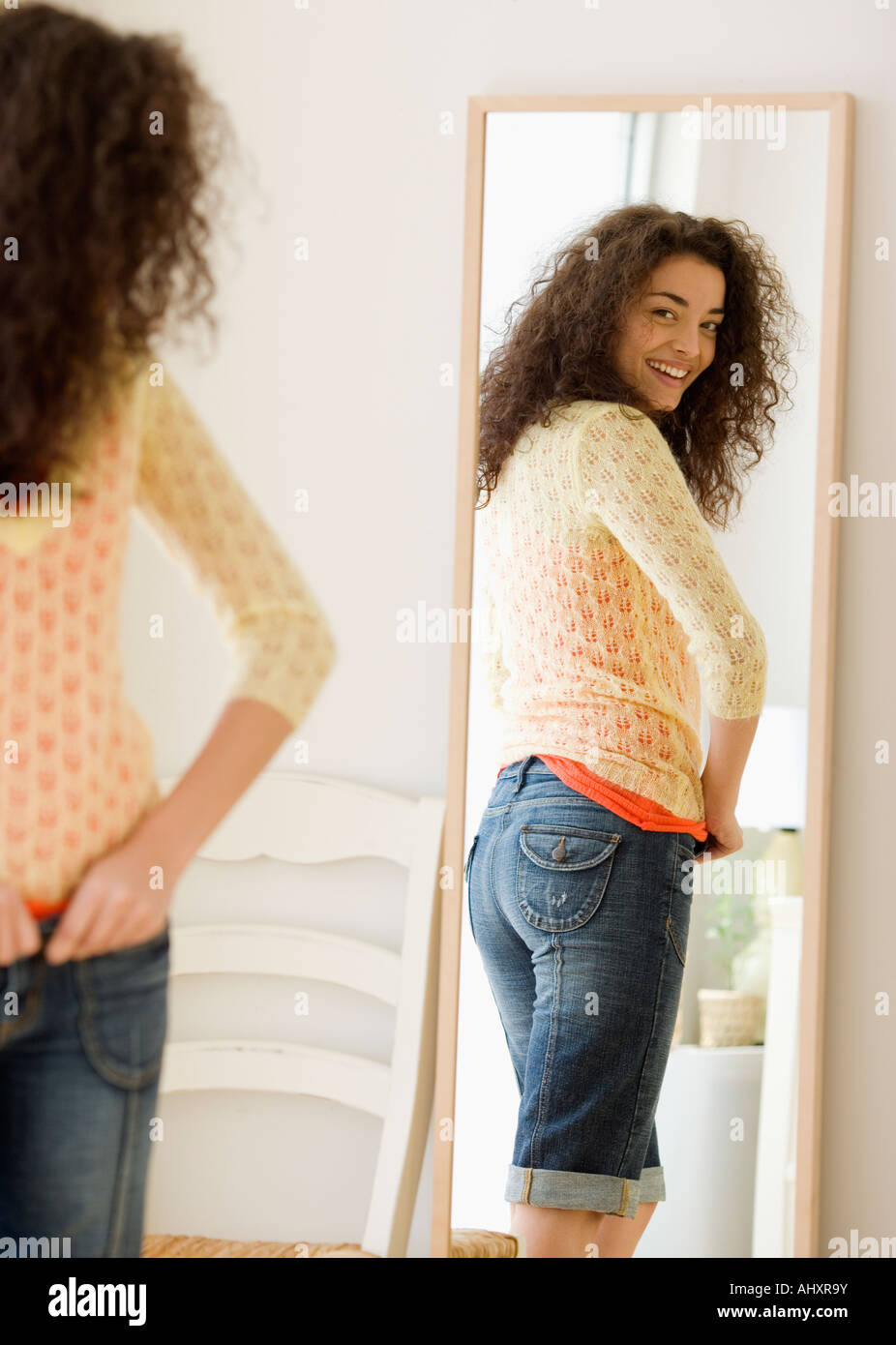 Woman Looking In The Mirror