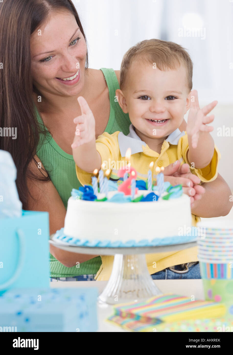 Baby celebrating birthday with mother Stock Photo - Alamy