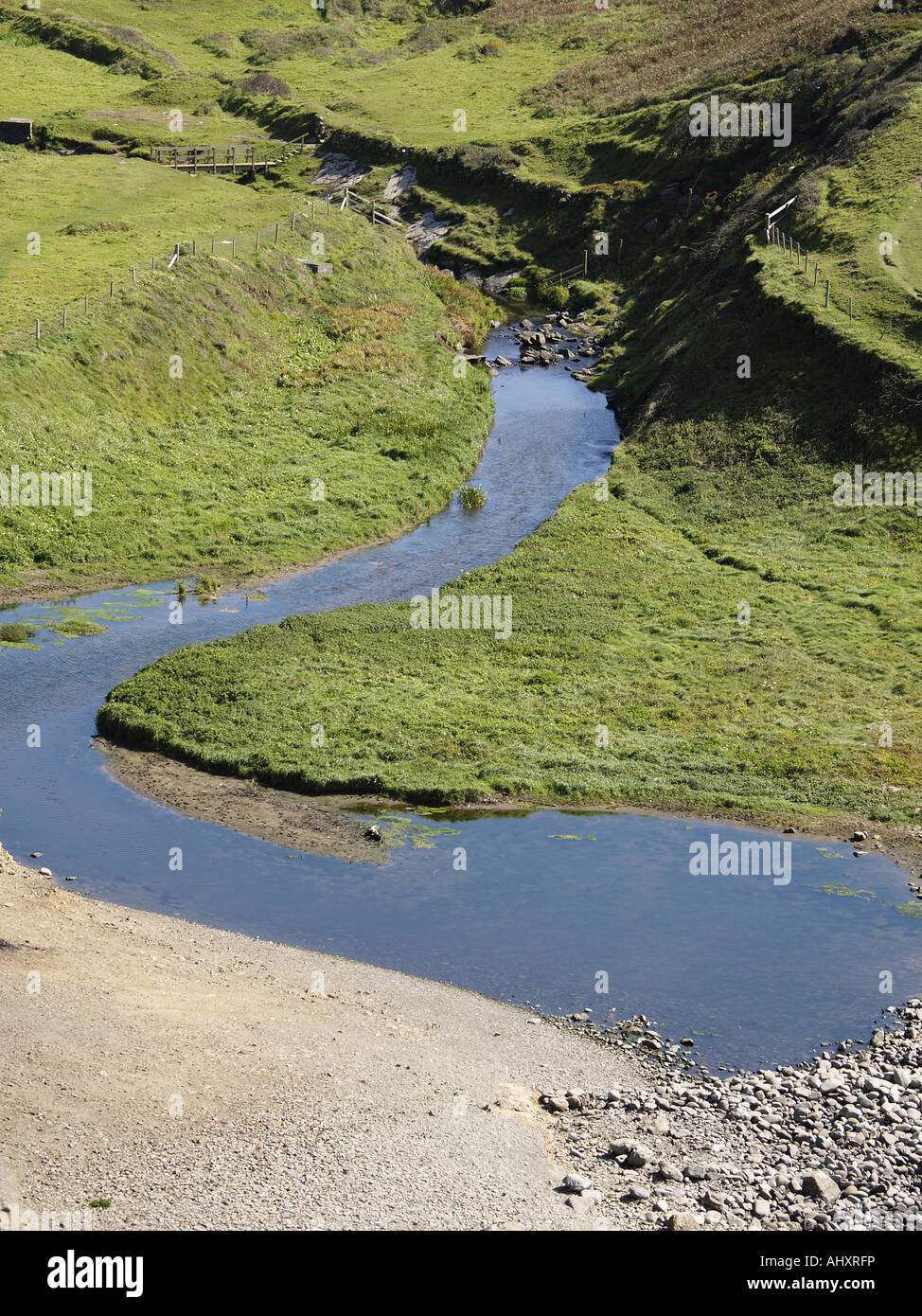 Winding stream, running through Coombe valley onto Duckpool Beach Stock ...