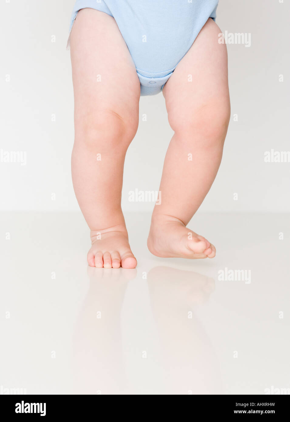Close up of baby walking Stock Photo - Alamy