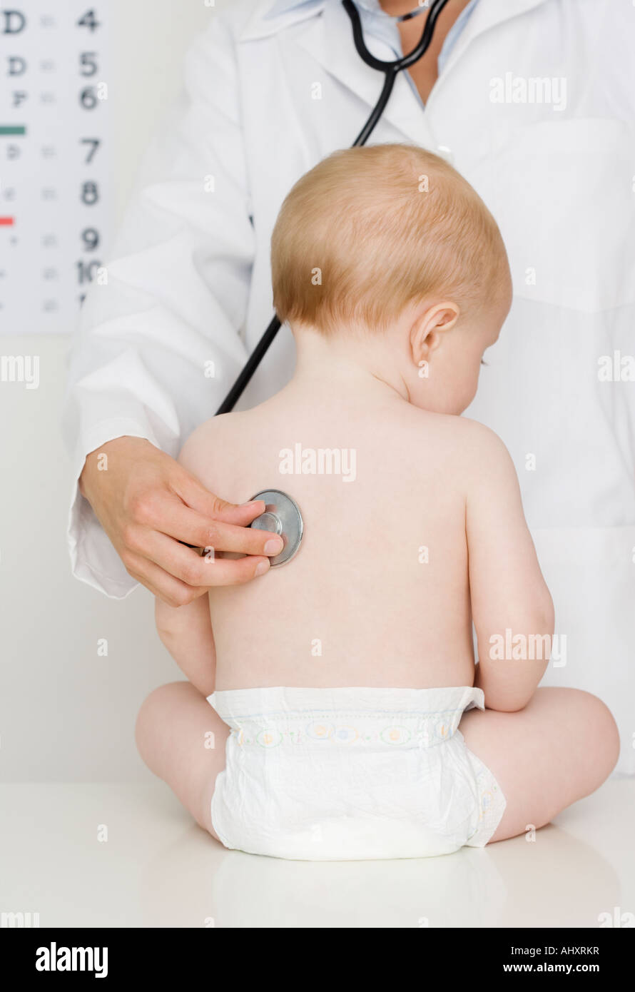Doctor examining baby Stock Photo - Alamy