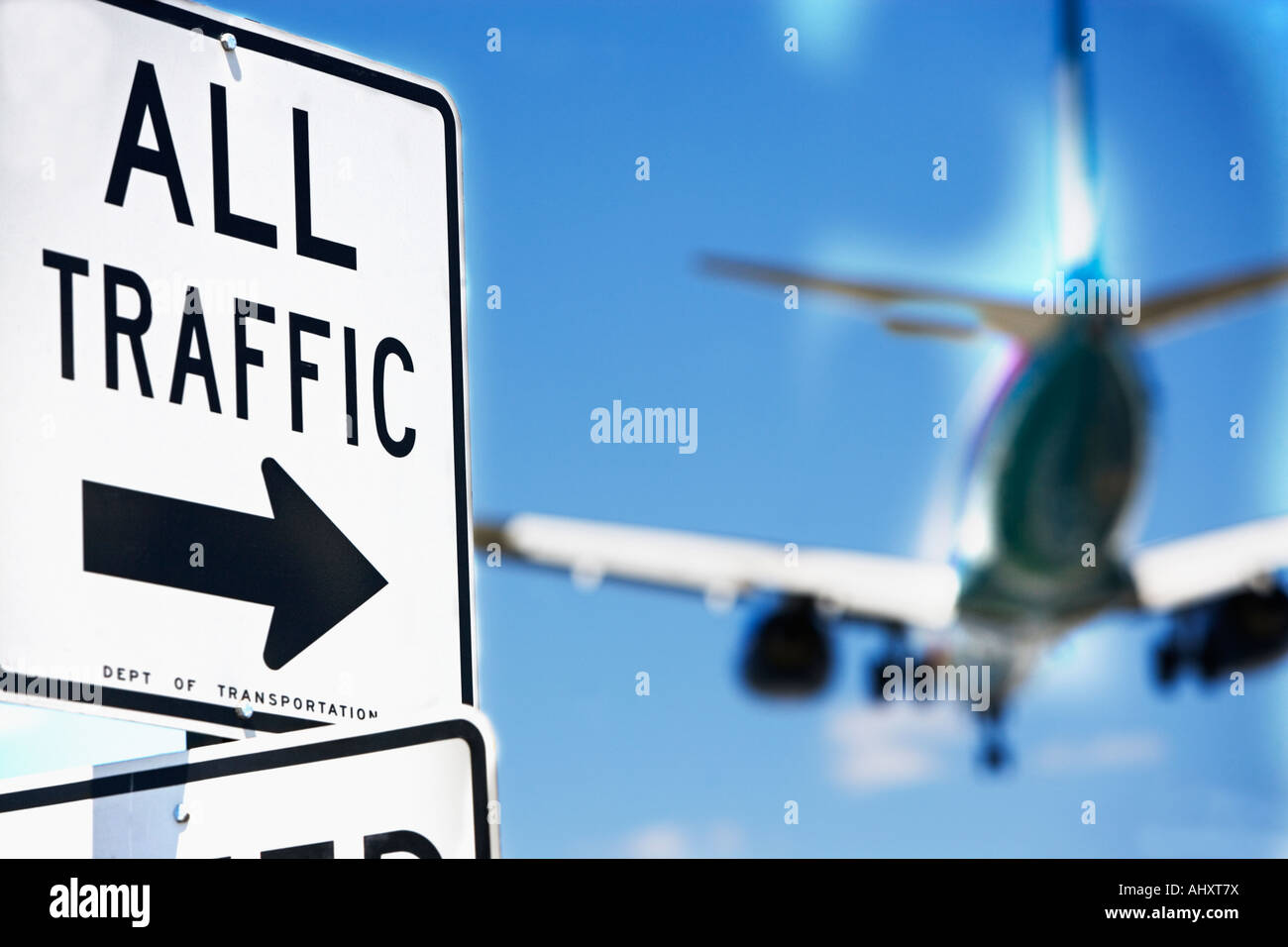 All traffic sign and airplane in background Stock Photo - Alamy