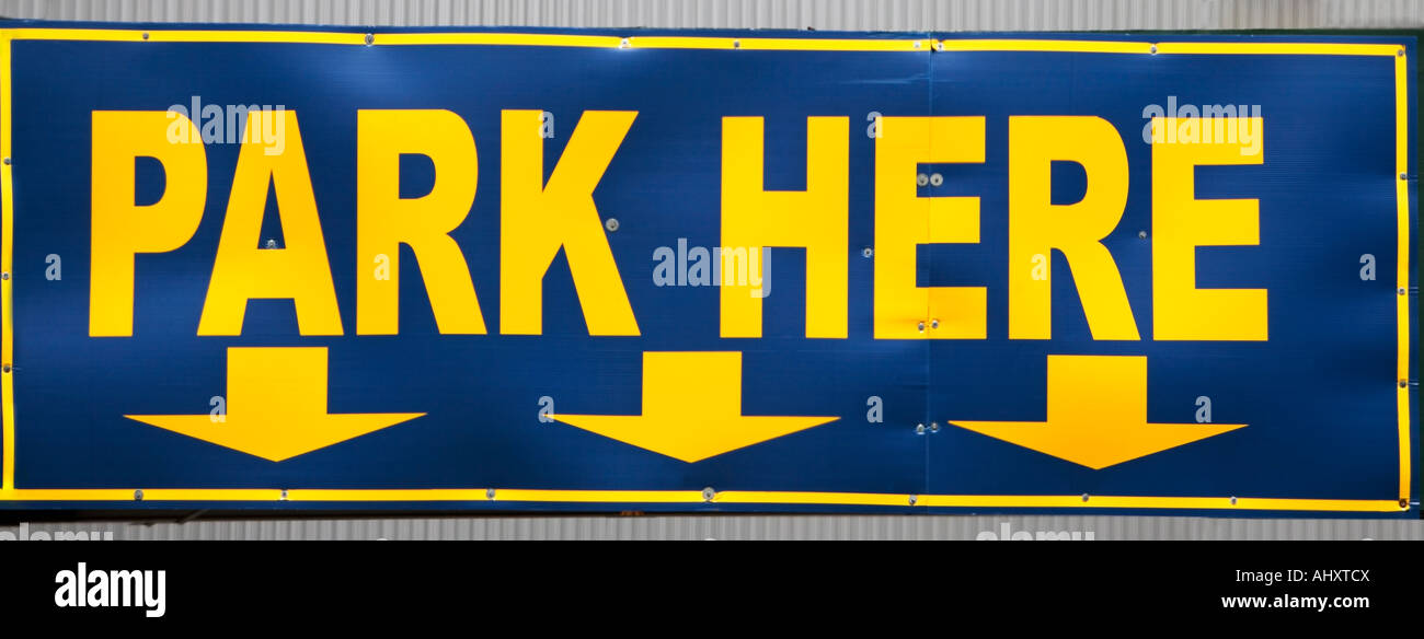 Park Here sign with arrows Stock Photo - Alamy