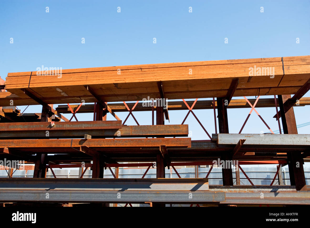 Lumber and metal stacked at construction site Stock Photo - Alamy