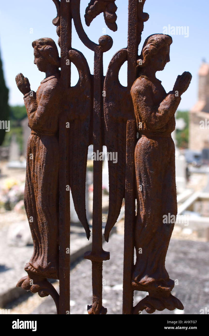 two rusted angels in a praying position back to back detail of a ...