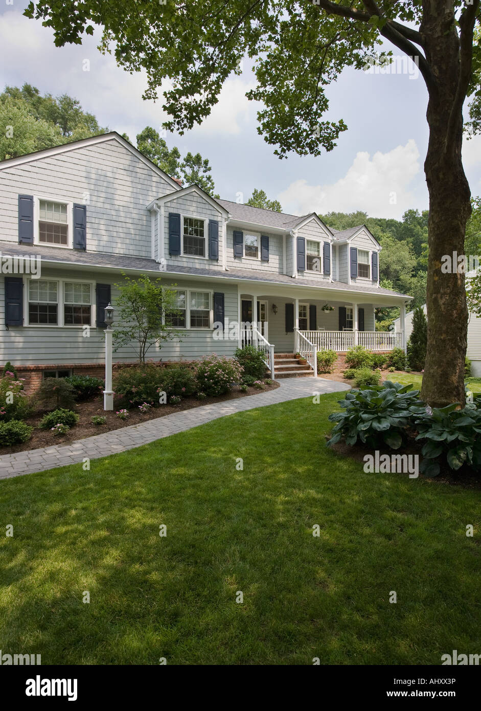 Exterior view of house with tree Stock Photo - Alamy