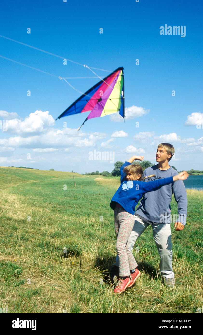Older sister helping younger brother hi-res stock photography and ...