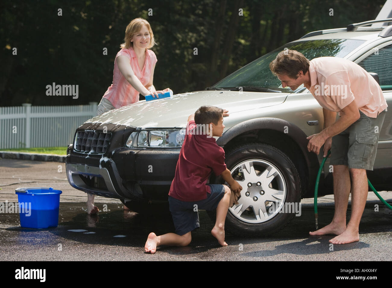 Family washing car in driveway Stock Photo - Alamy