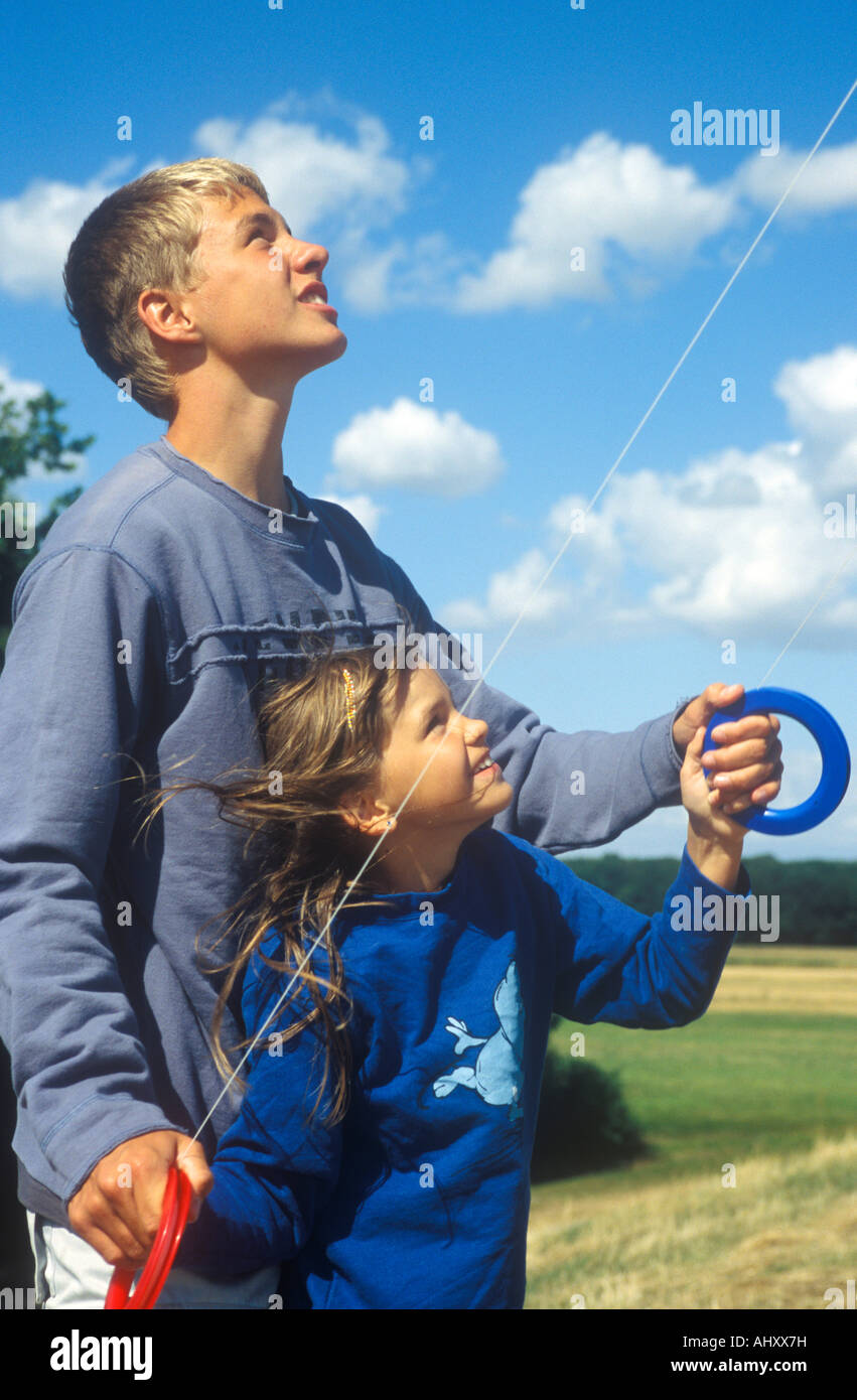 Older sister helping younger brother hi-res stock photography and ...