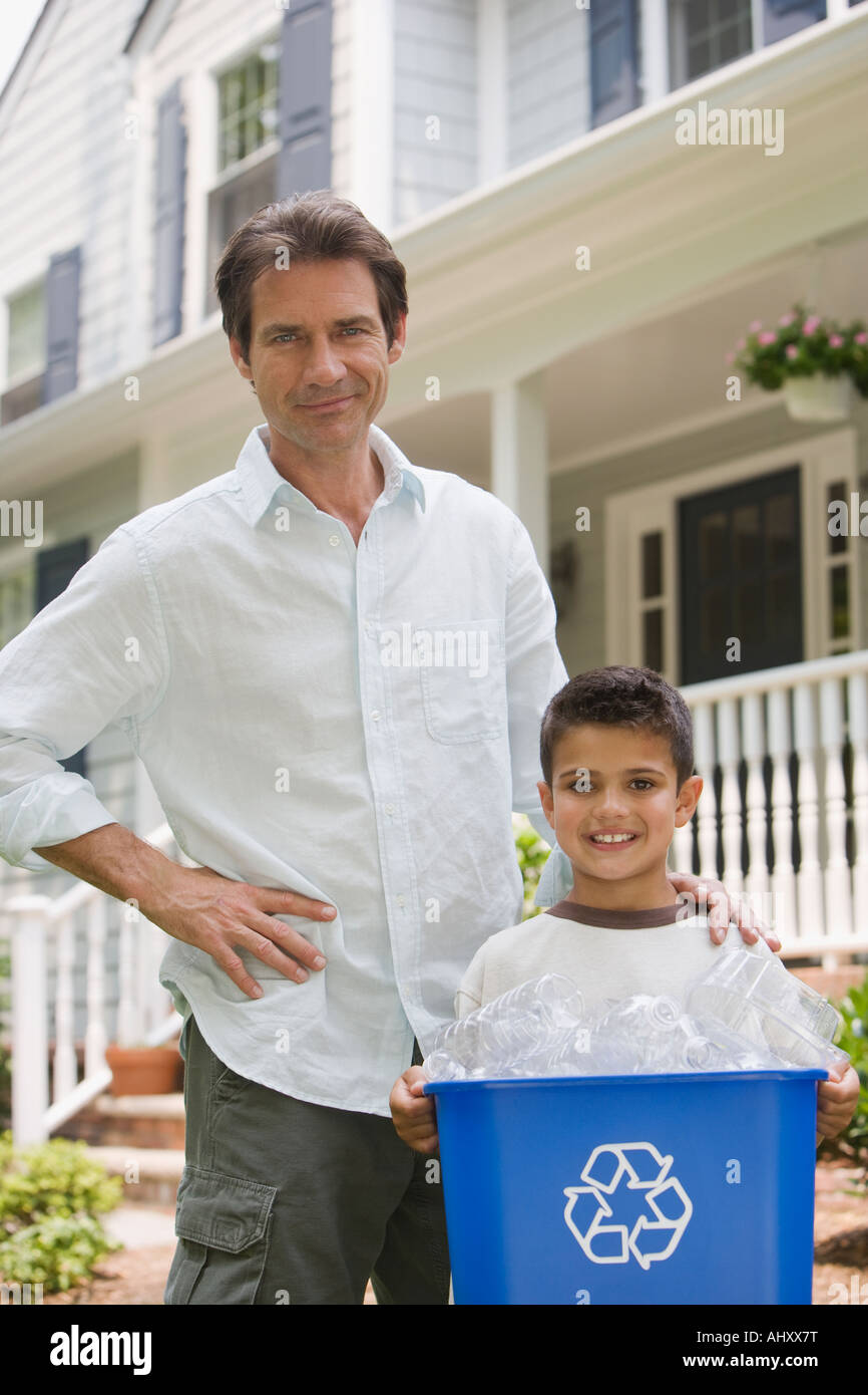 Father and son with recycling bin Stock Photo - Alamy