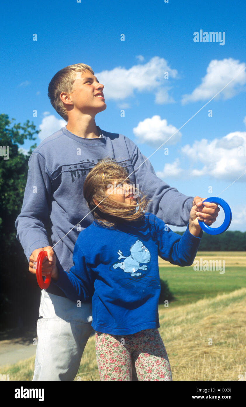 Older sister helping younger brother hi-res stock photography and ...