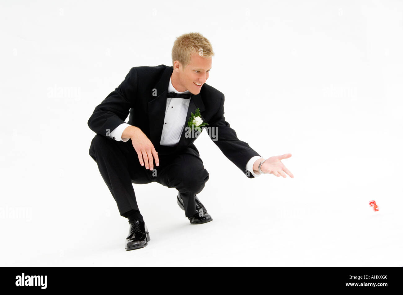 Man rolling dice Stock Photo - Alamy