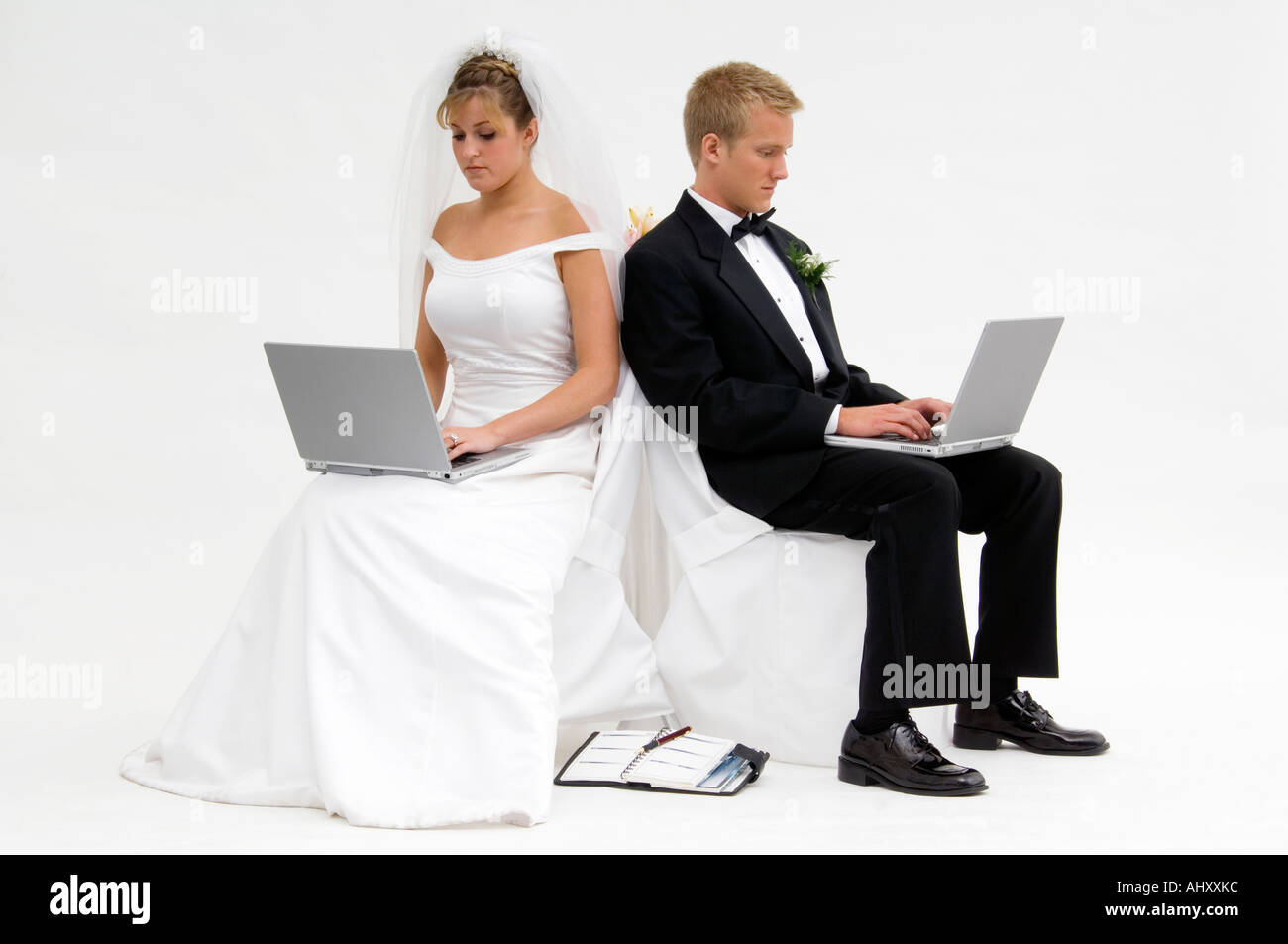 Bride and groom on laptops Stock Photo - Alamy