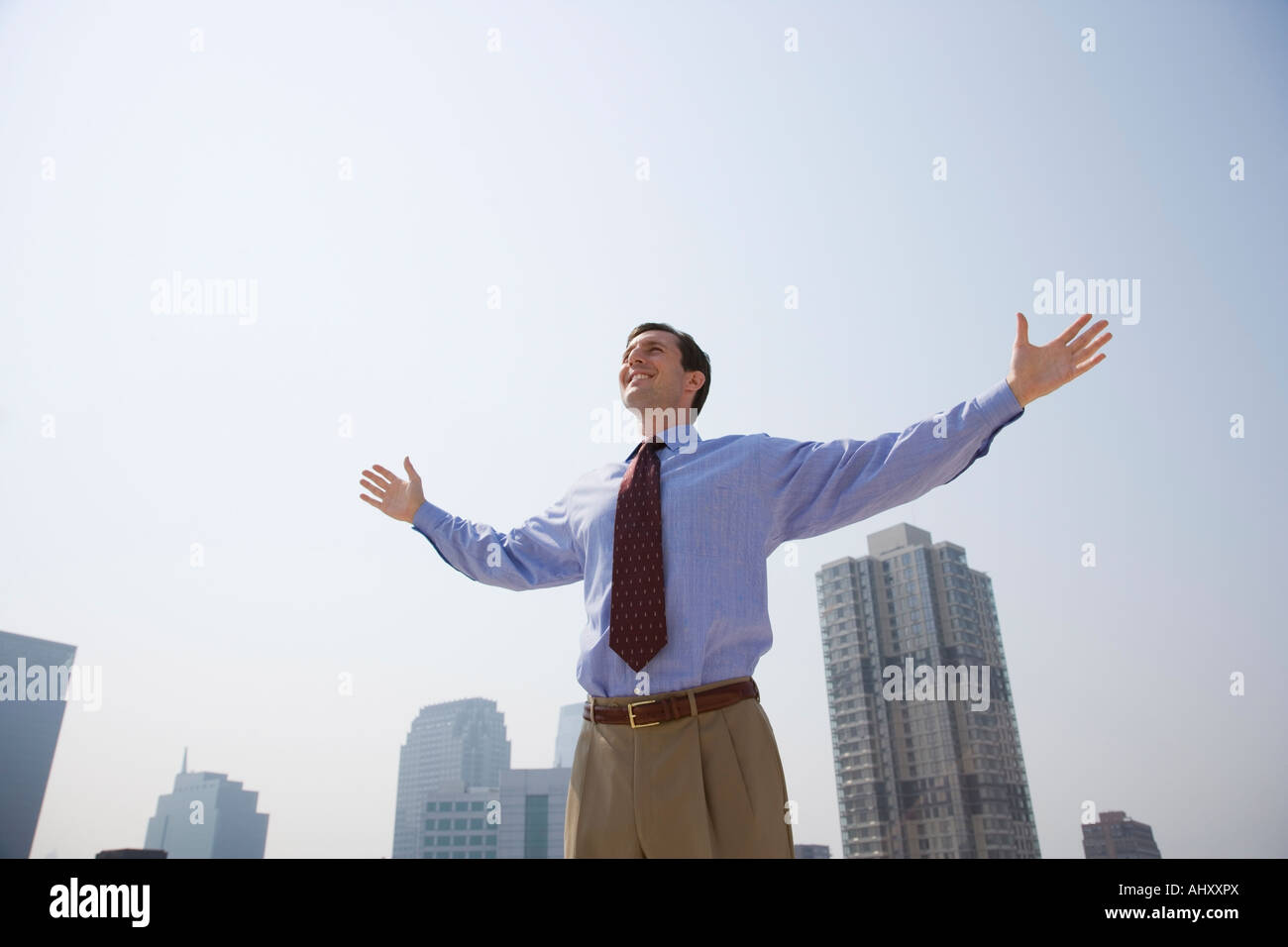 Businessman with arms outstretched Stock Photo - Alamy