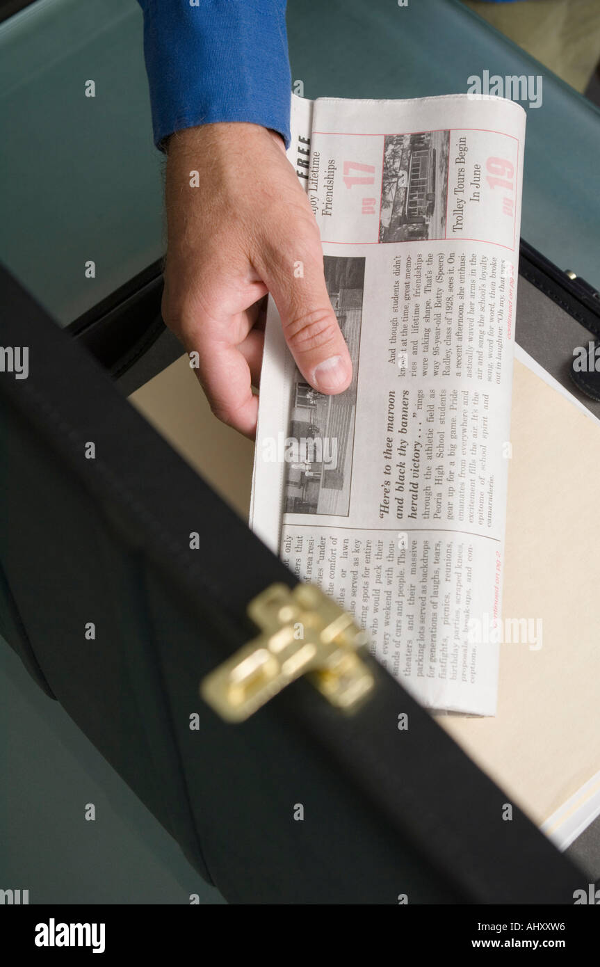 Briefcase and newspaper hi-res stock photography and images - Alamy