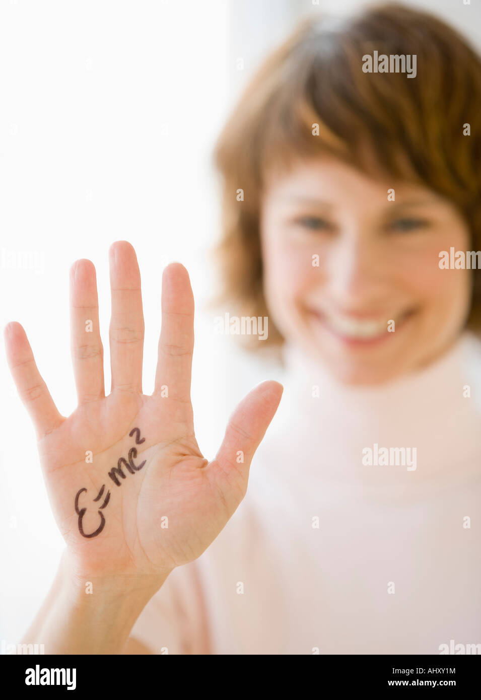 Woman with formula written on hand Stock Photo - Alamy