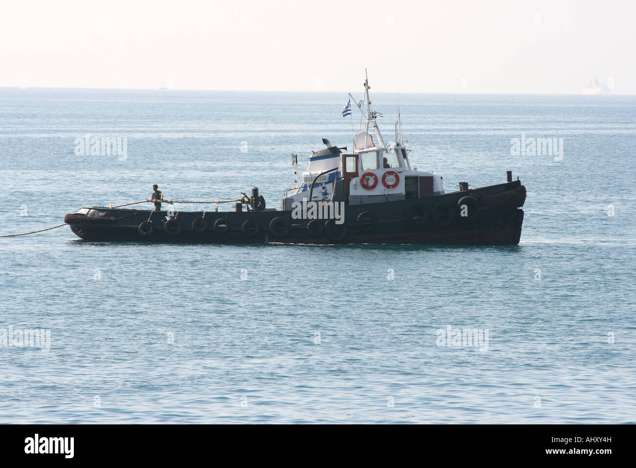 tugboat in action ship tender Stock Photo - Alamy