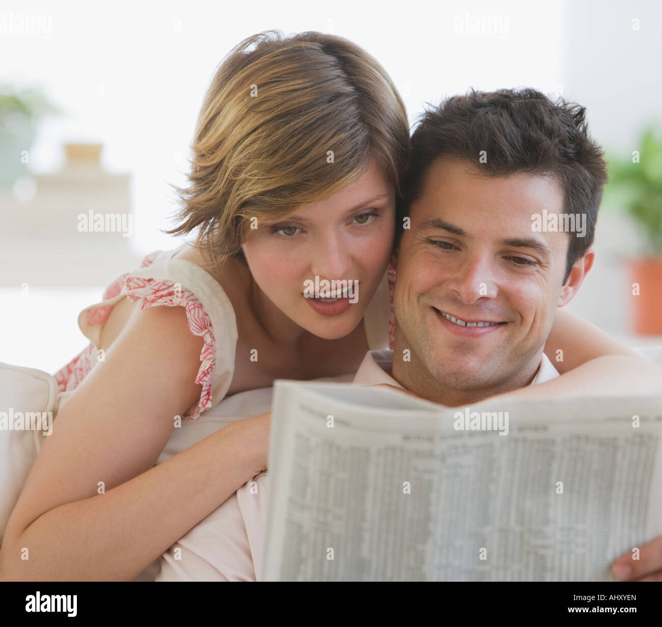 Young couple reading newspaper hi-res stock photography and images - Alamy