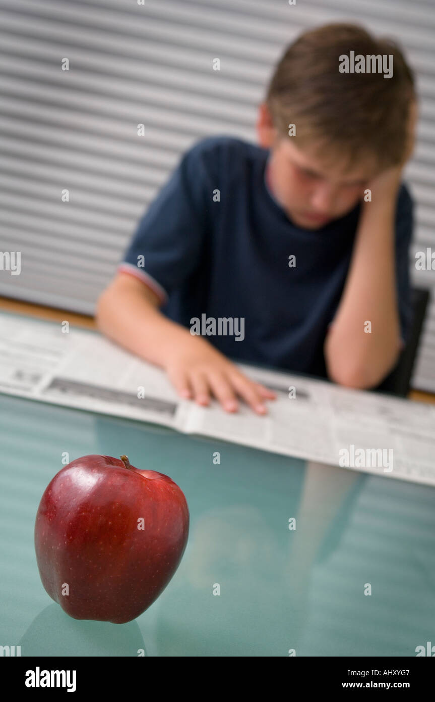 Boy reading newspaper Stock Photo - Alamy