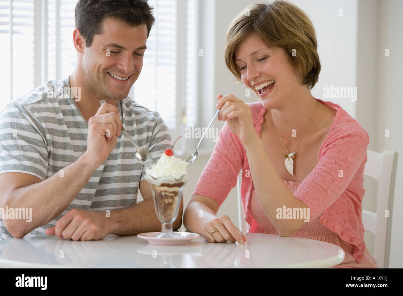 Couple sharing ice cream sundae Stock Photo - Alamy
