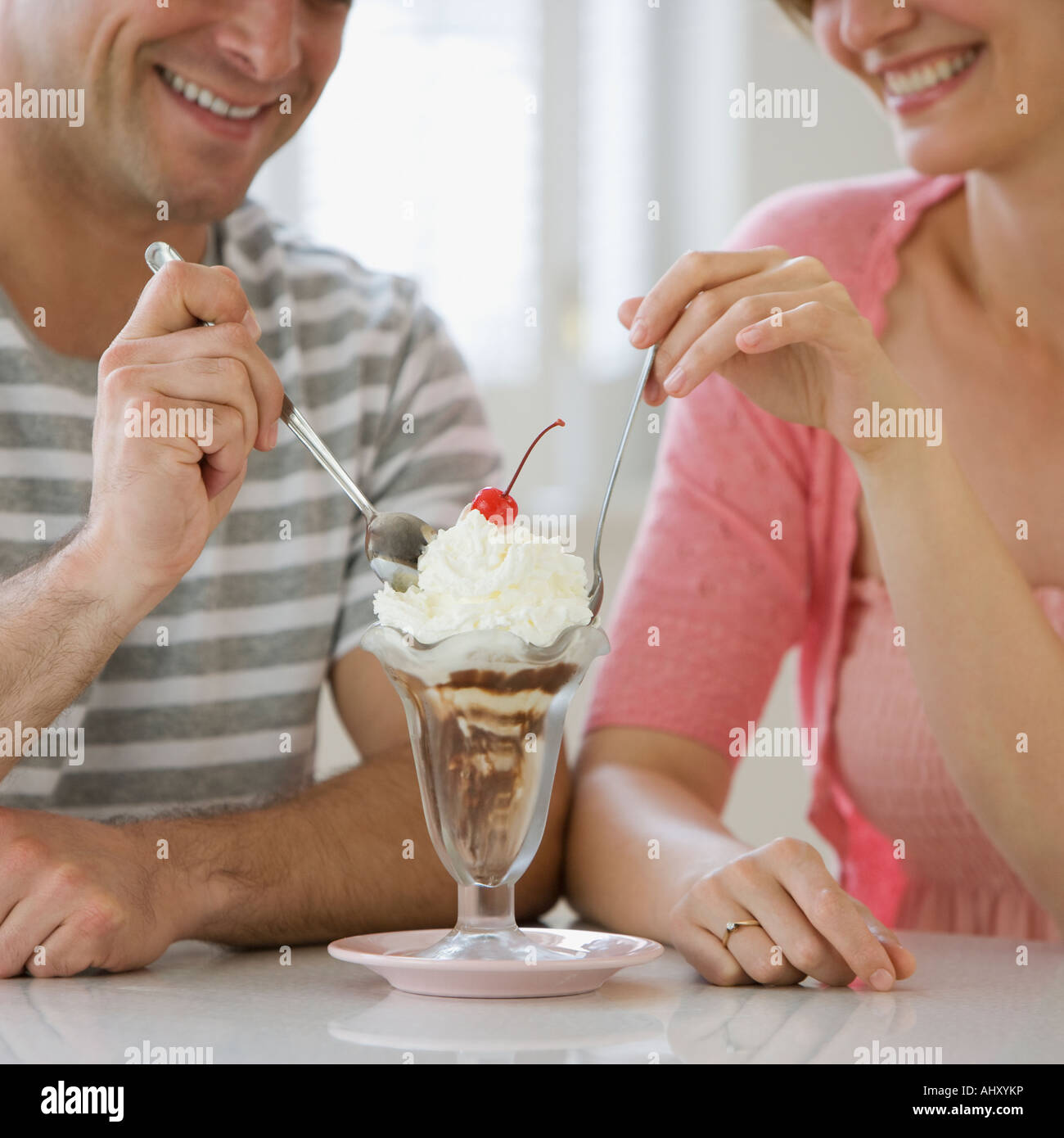 Couple sharing ice cream sundae Stock Photo - Alamy