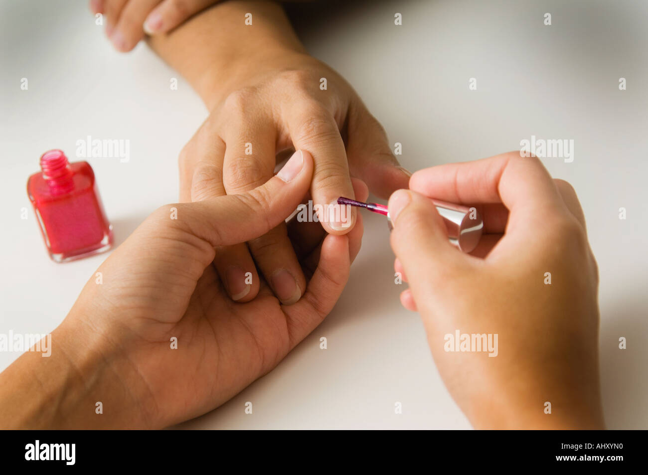 Girl getting a manicure hi-res stock photography and images - Alamy
