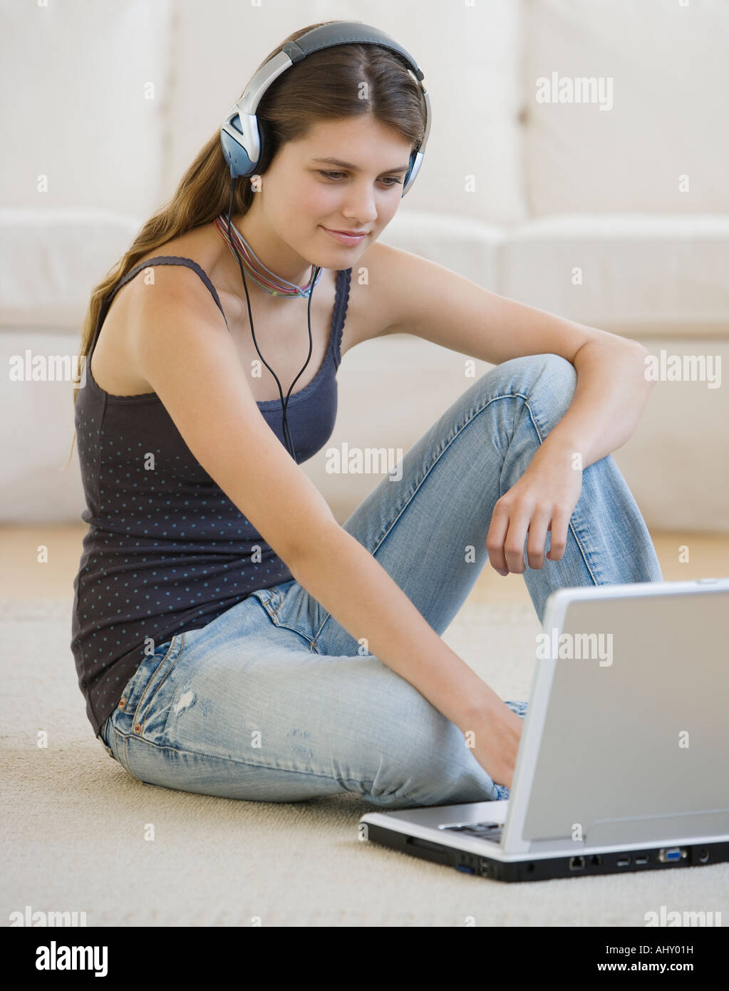 Girl typing on laptop Stock Photo - Alamy