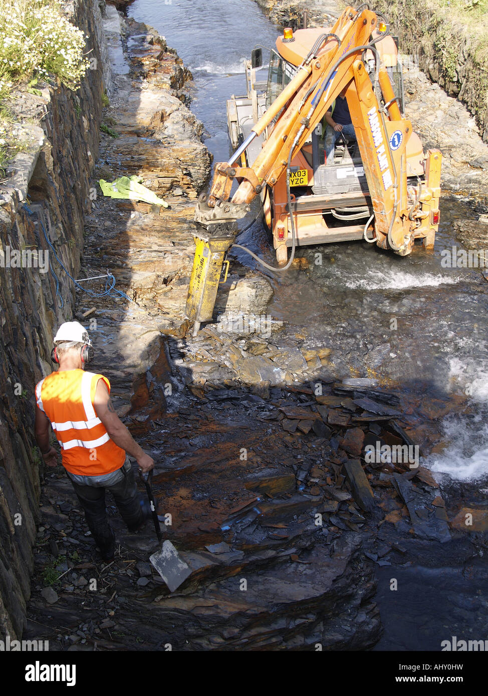 Workman working on the river widening at Boscastle. 12 September 2007 ...