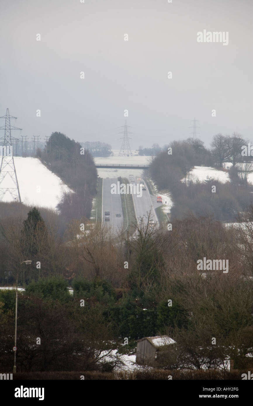 Countryside road pylon field Stock Photo - Alamy