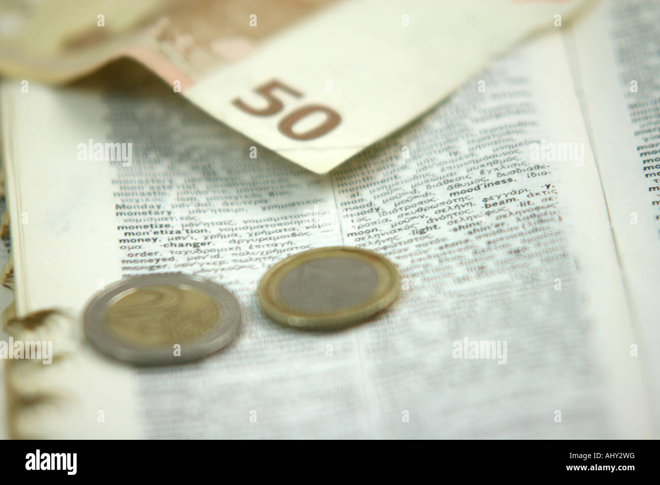 dictionary on the word money and euros Stock Photo - Alamy