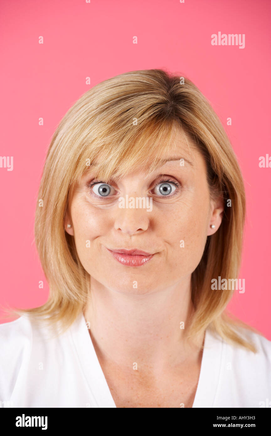 PORTRAIT OF ATTRACTIVE YOUNG BLONDE WOMAN WITH FACIAL EXPRESSION OF ...