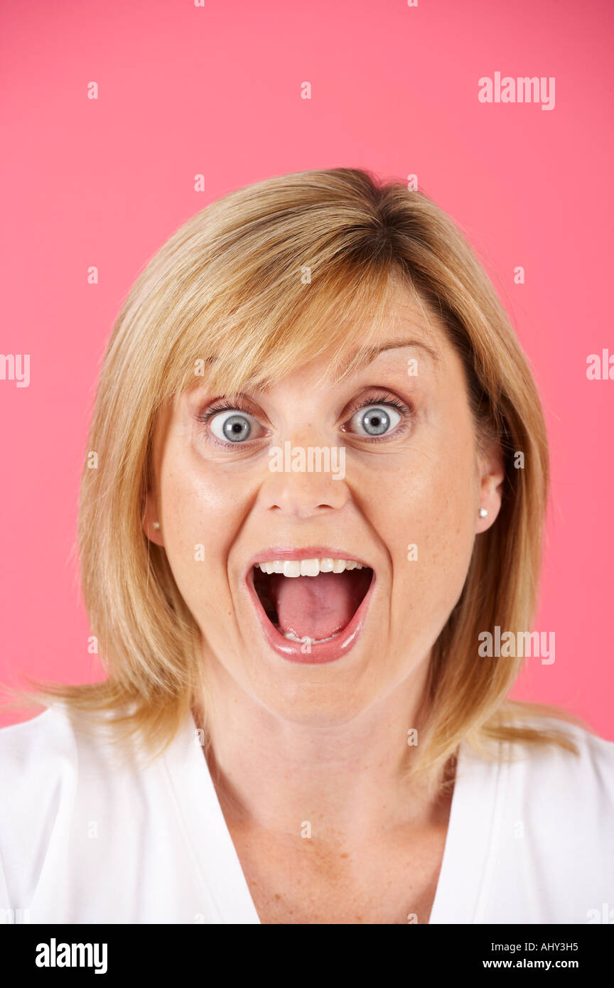 PORTRAIT OF ATTRACTIVE YOUNG BLONDE WOMAN WITH FACIAL EXPRESSION OF ...