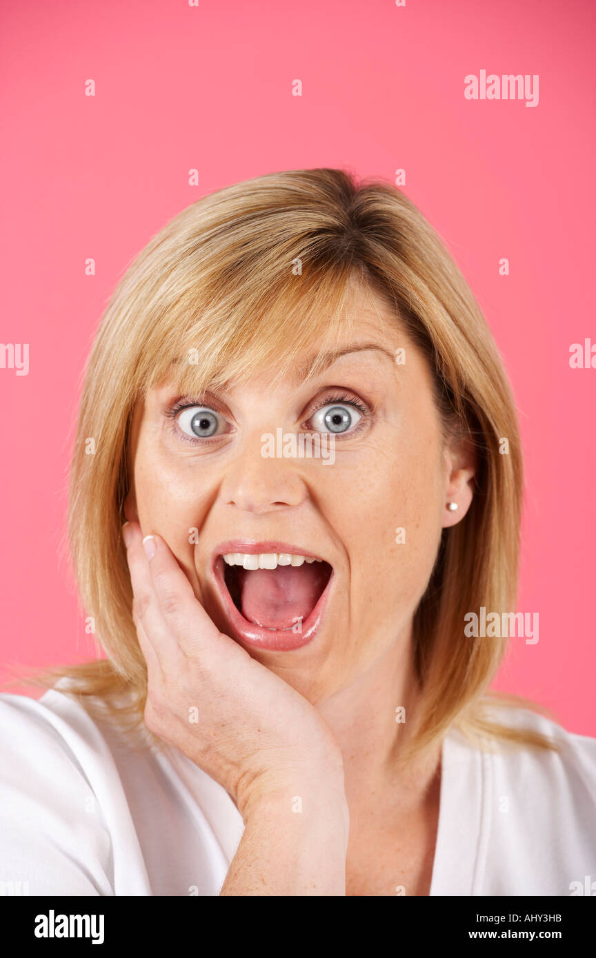 PORTRAIT OF ATTRACTIVE YOUNG BLONDE WOMAN WITH FACIAL EXPRESSION OF ...