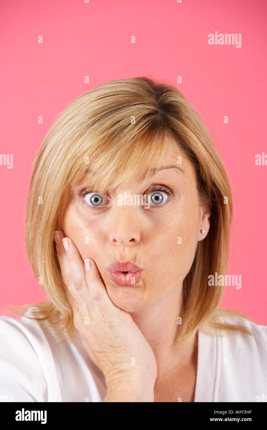 PORTRAIT OF ATTRACTIVE YOUNG BLONDE WOMAN WITH FACIAL EXPRESSION OF ...