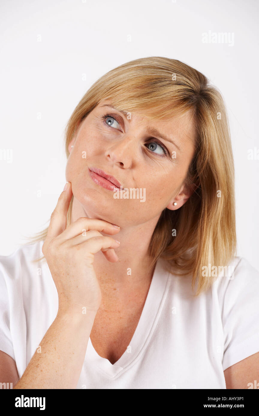PORTRAIT OF ATTRACTIVE YOUNG BLONDE WOMAN WITH FACIAL EXPRESSION OF ...