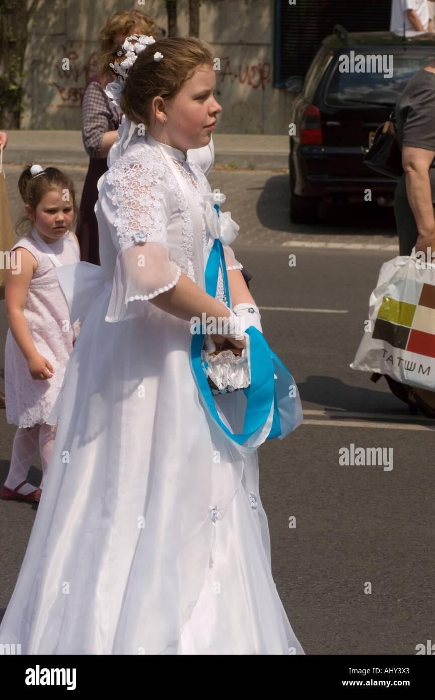 Polish Roman Catholic girls in white robes carrying flowers during ...