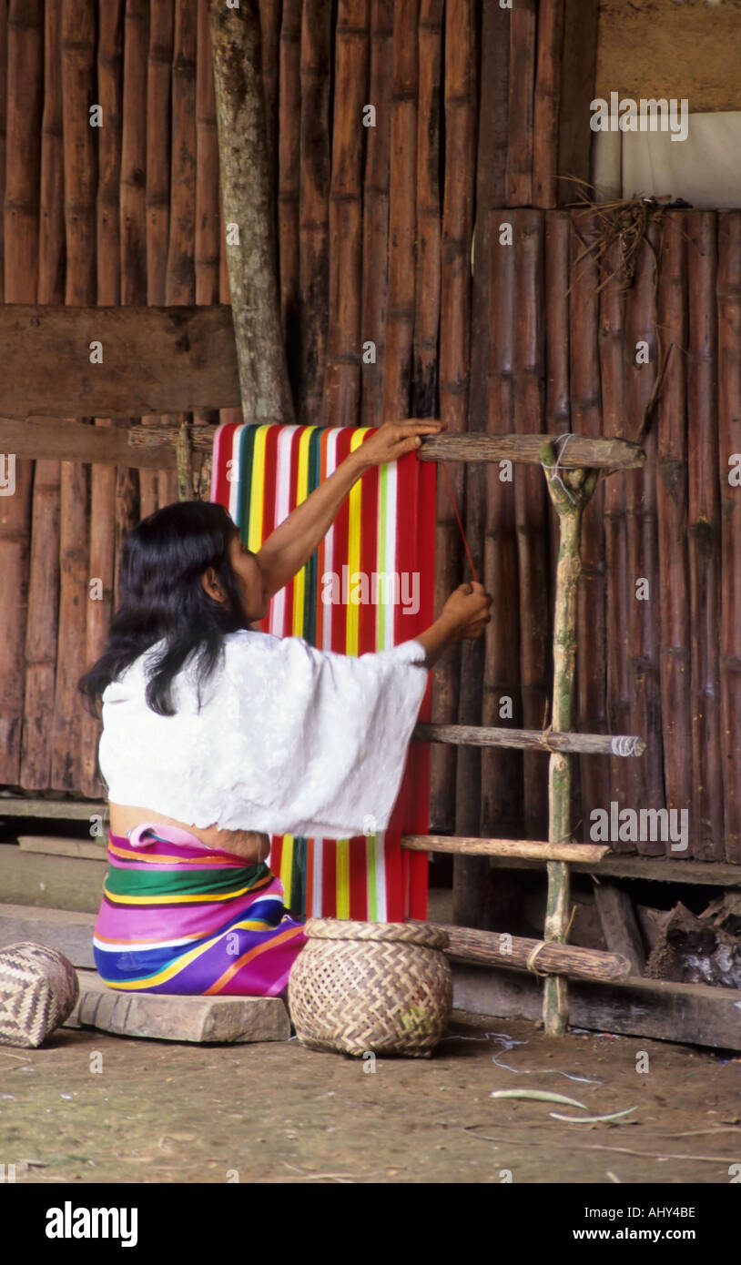 Colorado Indian woman weaving traditional cloth, Ecuador Stock Photo ...