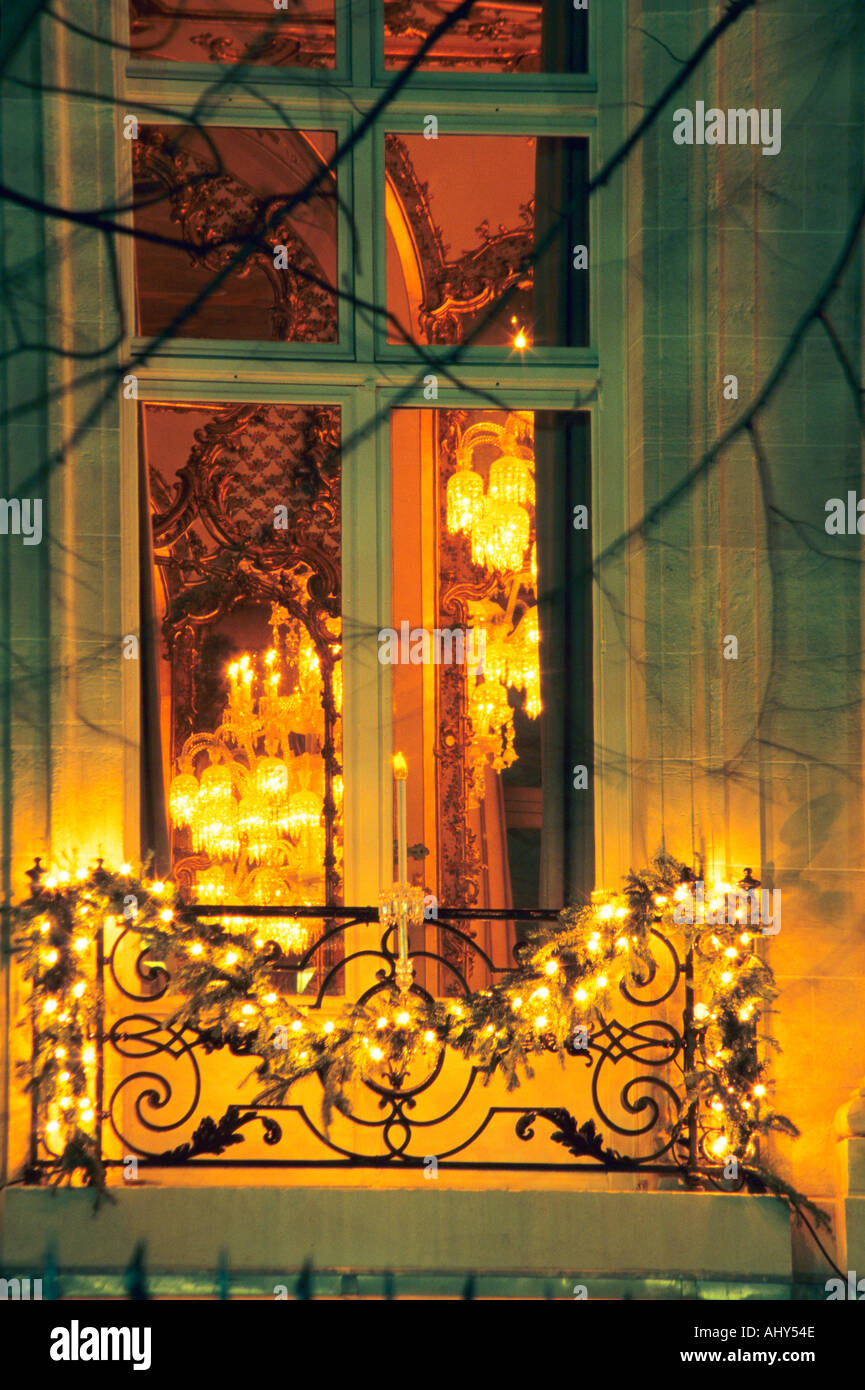 Outside looking in, through a window the crystal candelabra and ...