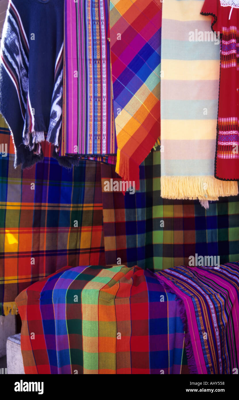 Brightly coloured cloth for sale, Otavalo craft market, Ecuador Stock ...