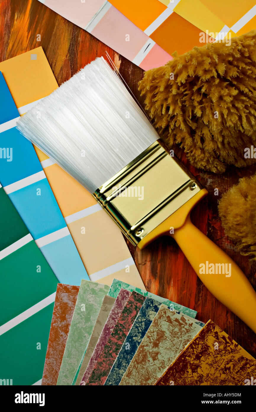 Paintbrush and assorted paint swatches with sponge Stock Photo - Alamy