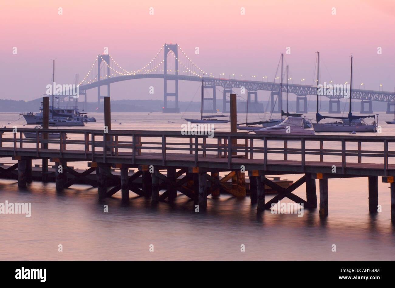Docks and the Newport Bridge at sunset in Newport, Rhode Island Stock ...