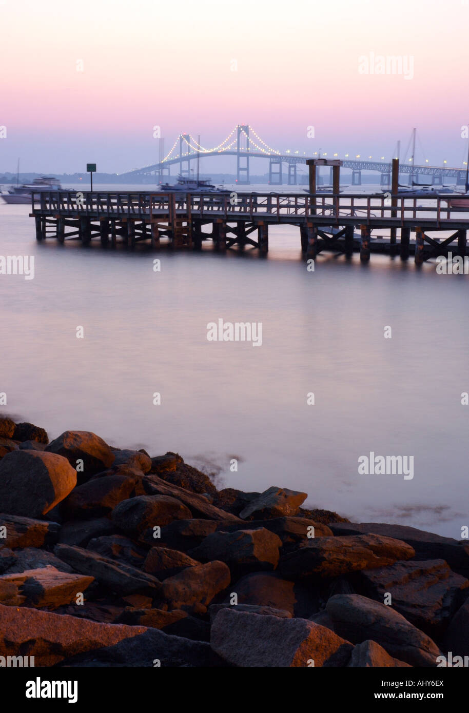 Docks and the Newport Bridge at sunset in Newport, Rhode Island Stock ...