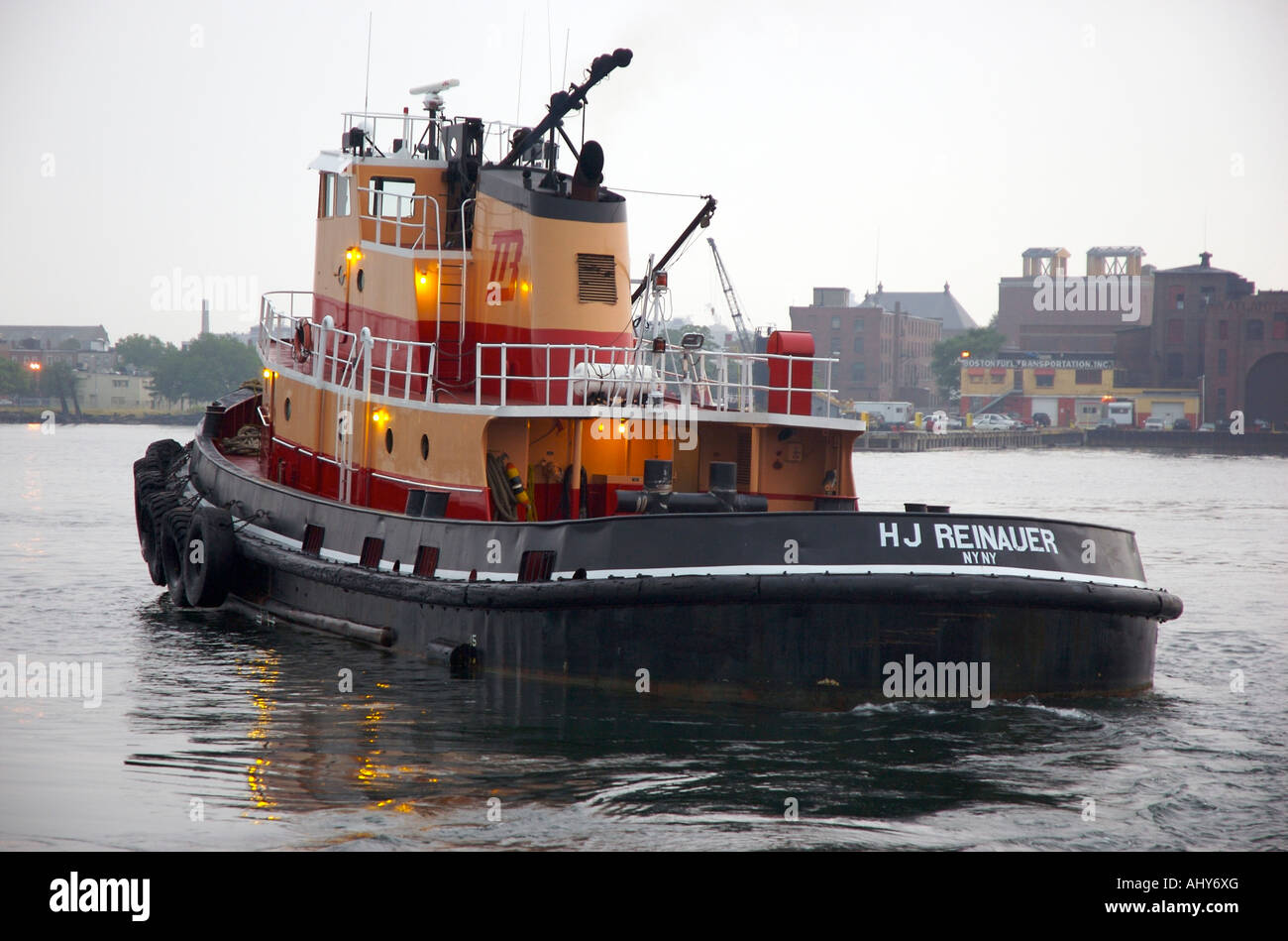 A large commercial tug boat at work in Boston harbor. Massachusetts ...